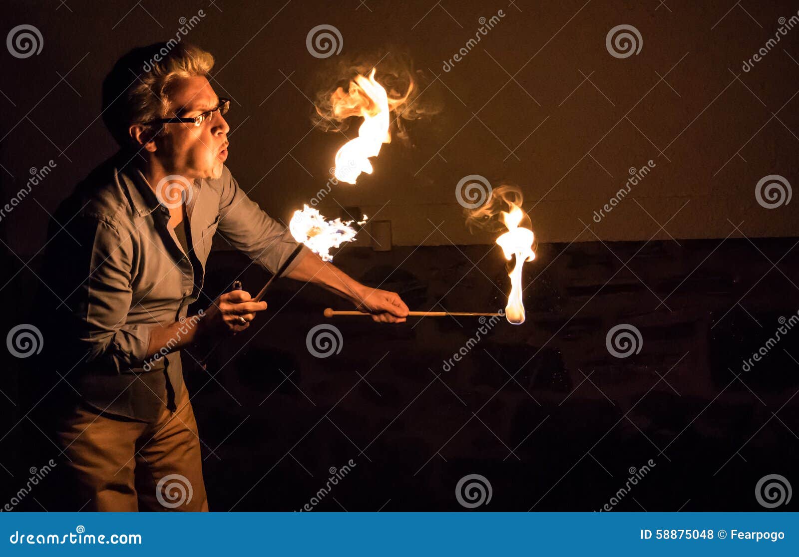 Man Blows Fire into the Night Stock Photo - Image of glasses, flame ...