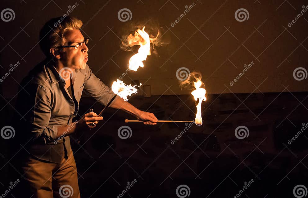 Man Blows Fire into the Night Stock Photo - Image of glasses, flame ...