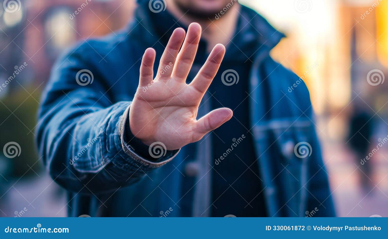 A Man in a Blue Jacket is Making a Stop Sign with His Hand Stock Photo ...