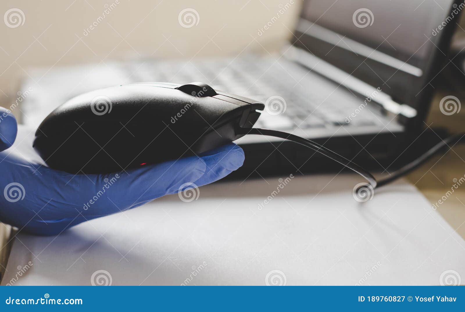 A Man in Blue Rubber Gloves Holds a Computer Mouse, Stock Image - Image ...