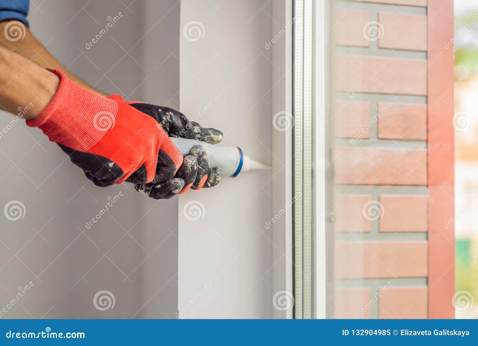 Man in a Blue Shirt Does Window Installation Stock Image - Image of ...