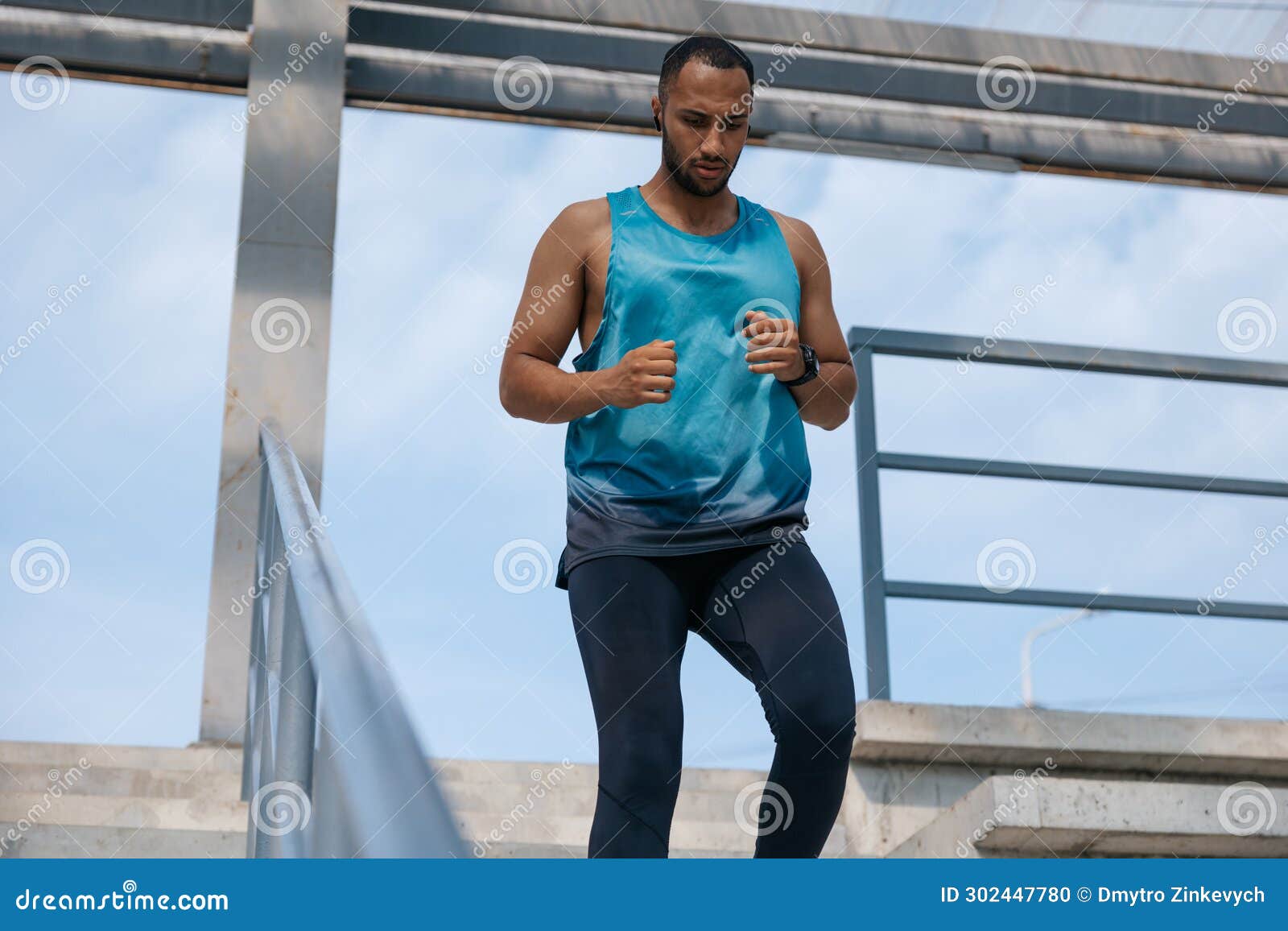 Man in Blue Tshirt Running and Looking Concentrated Stock Photo - Image ...