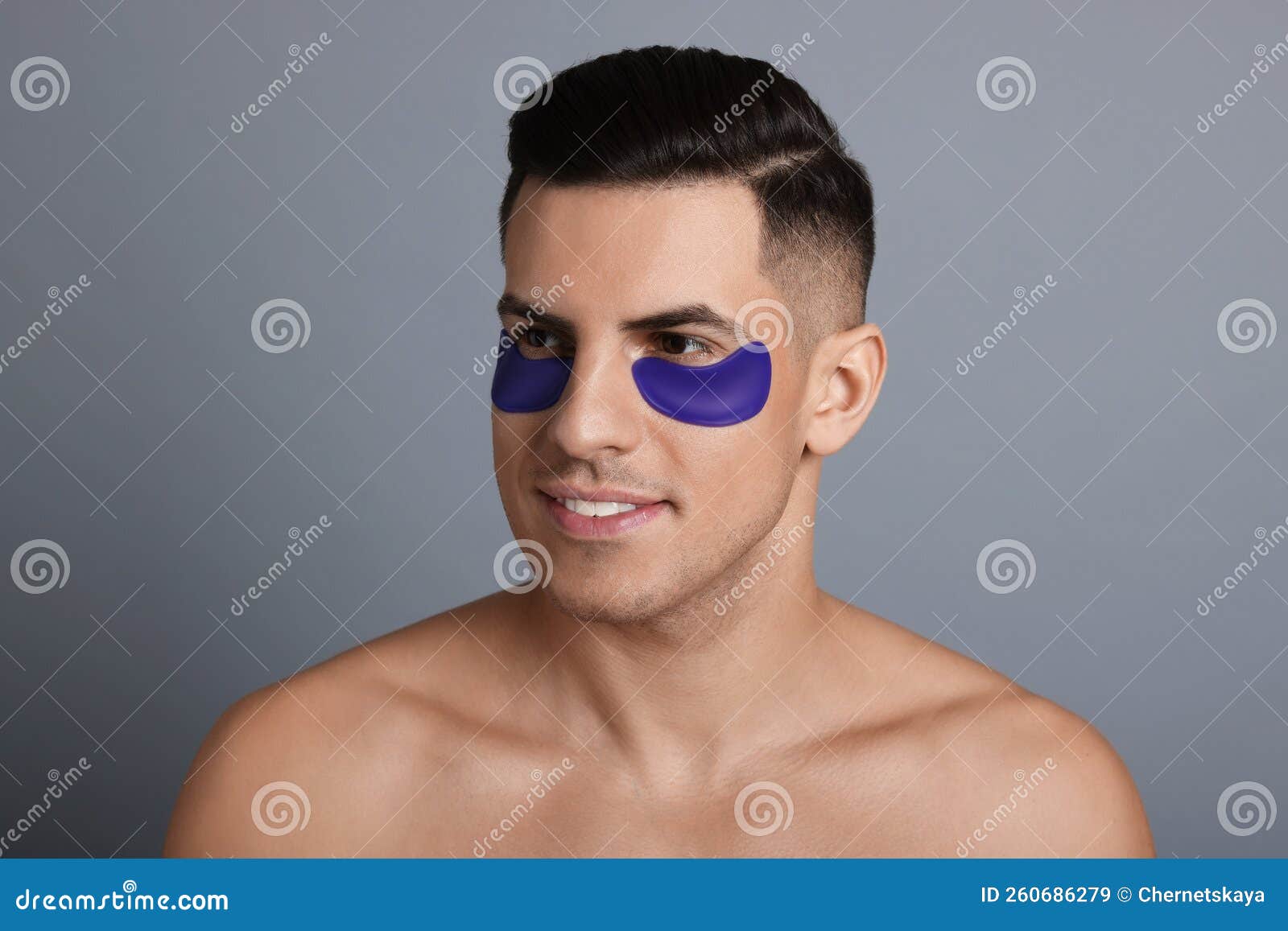 Man with Blue Under Eye Patches on Grey Background Stock Image - Image ...