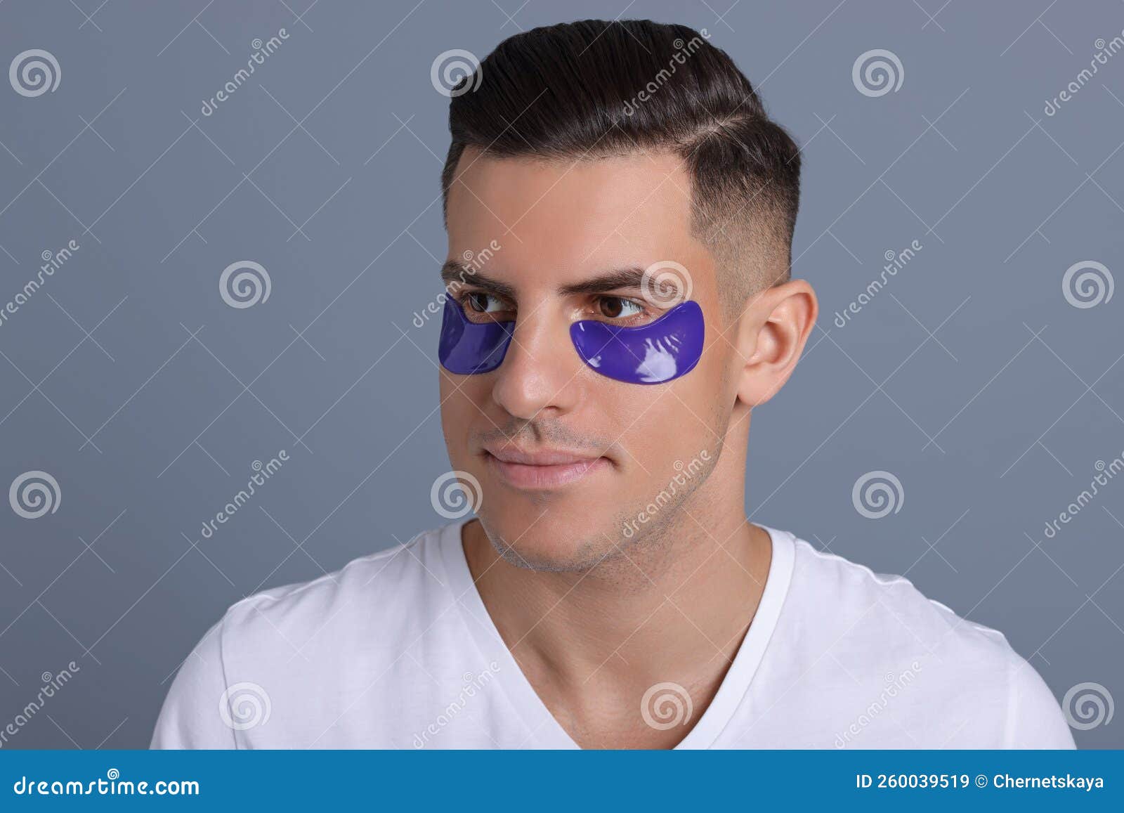 Man with Blue Under Eye Patches on Grey Background Stock Image - Image ...