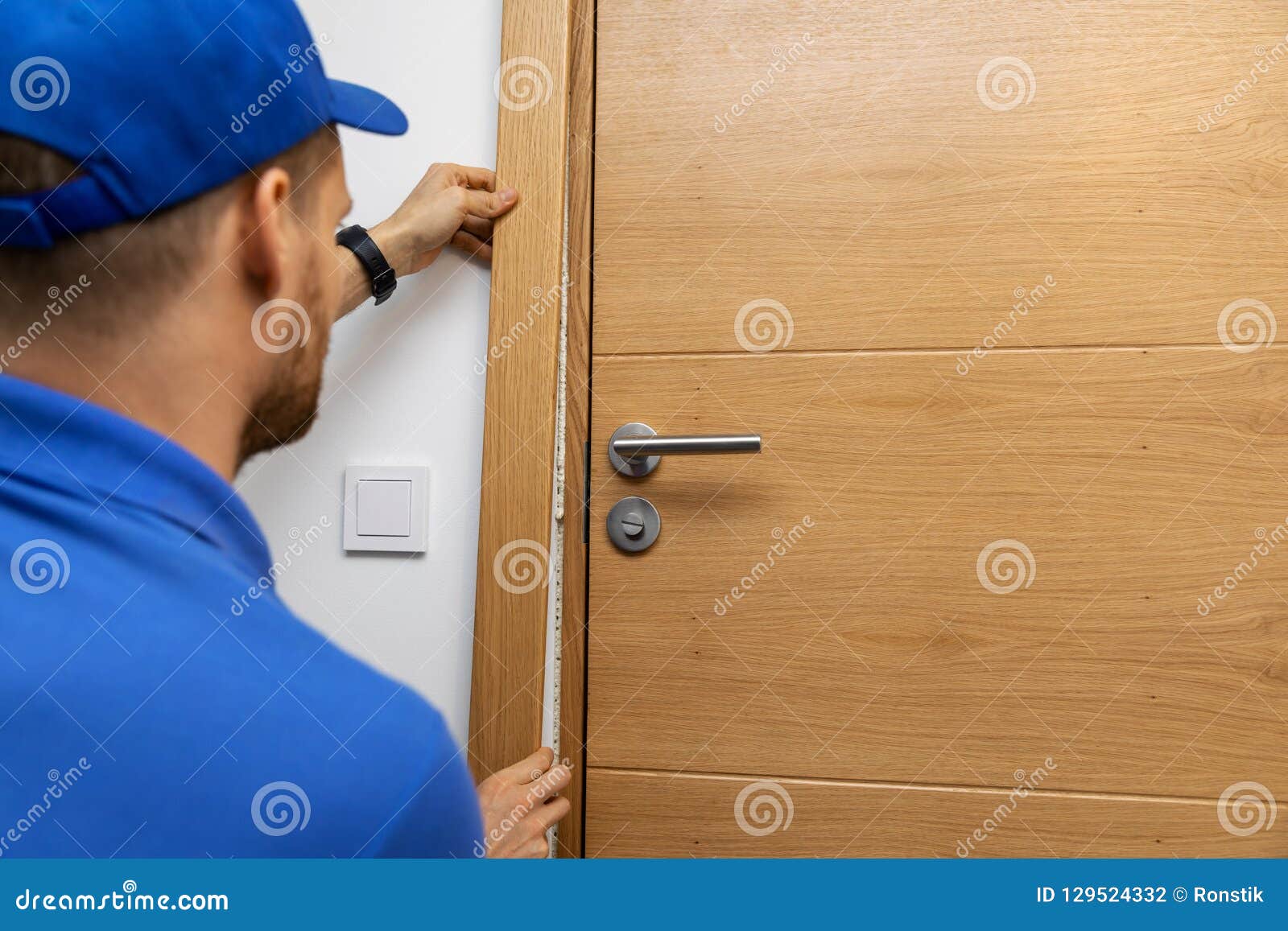 Installing A Door Blocker Bar Royalty-Free Stock Photography ...