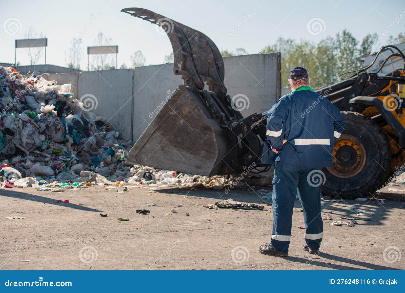 Man Looking at Garbage at Landfill Stock Photo - Image of standing ...