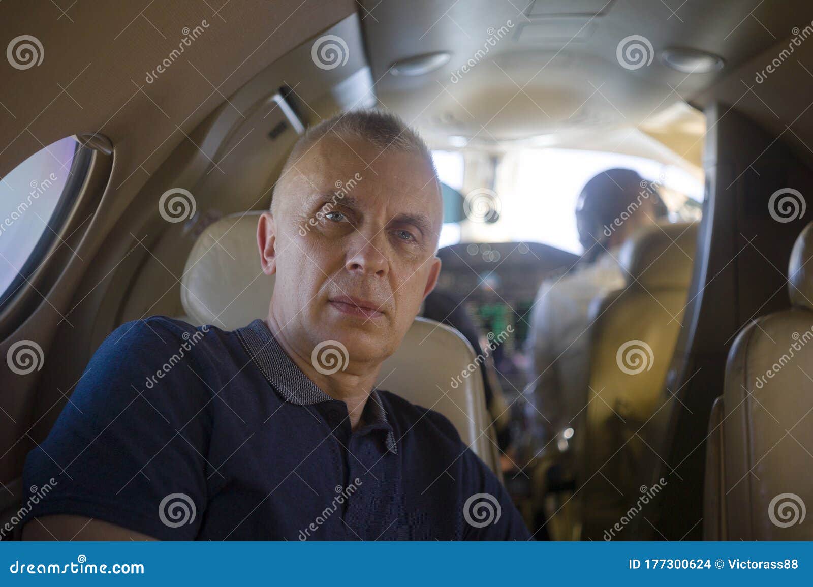Man on a Board of Private Jet Stock Photo - Image of sitting, seat ...