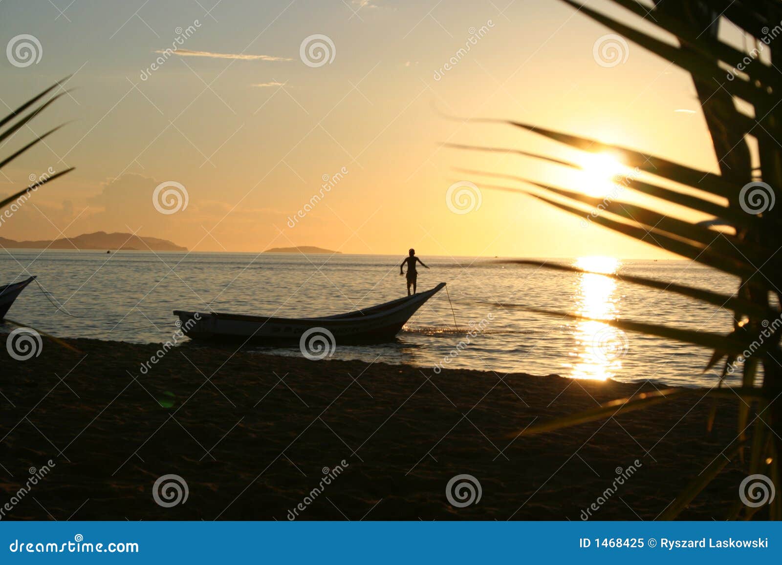 Man on the boat at sunset stock image. Image of sail, play - 1468425