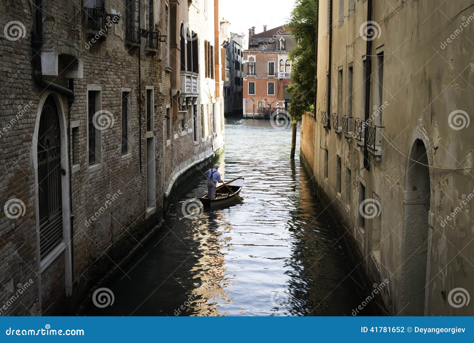 Man on a boat in Venice editorial photography. Image of cruise - 41781652