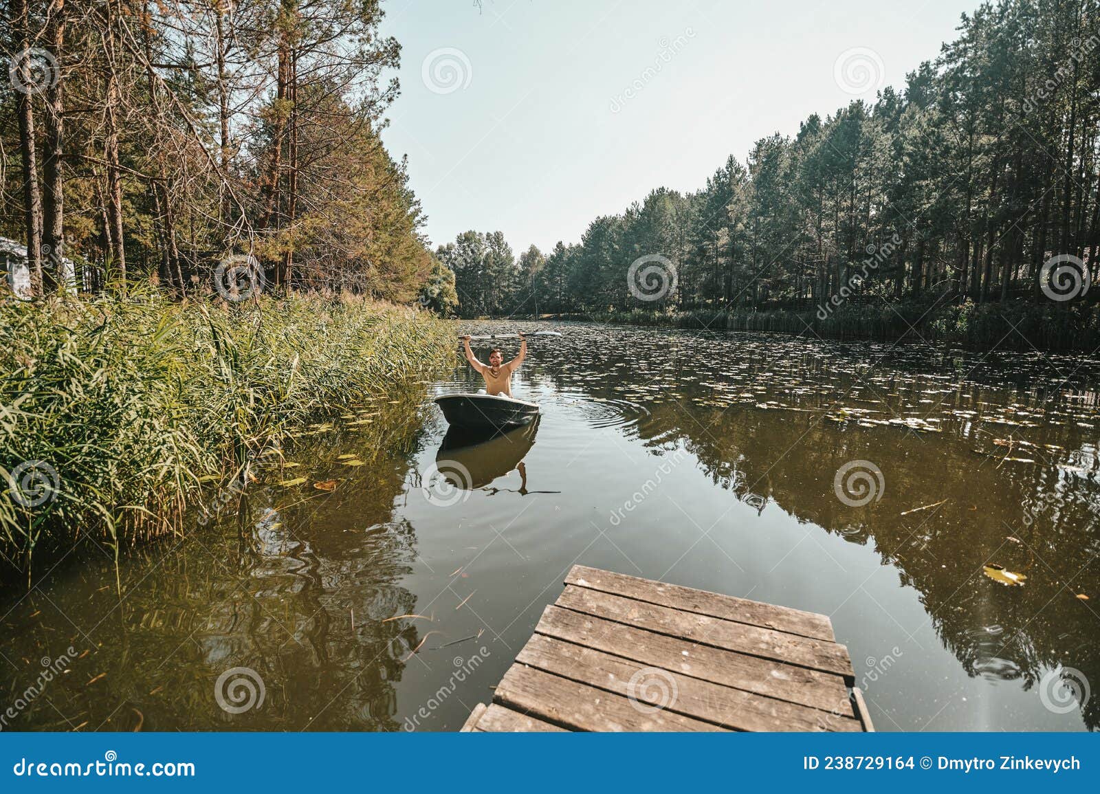 A Man Boating on a River and Looking Excited Stock Photo - Image of ...
