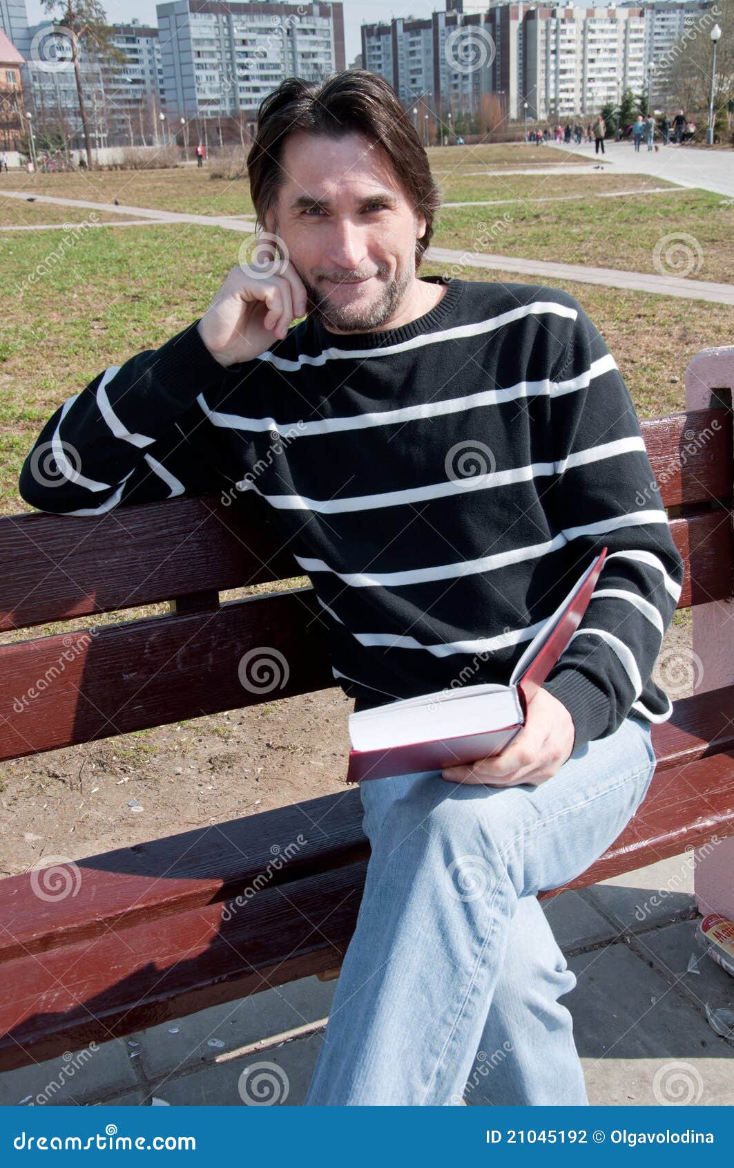 Man with book on a bench stock photo. Image of hair, sports - 21045192