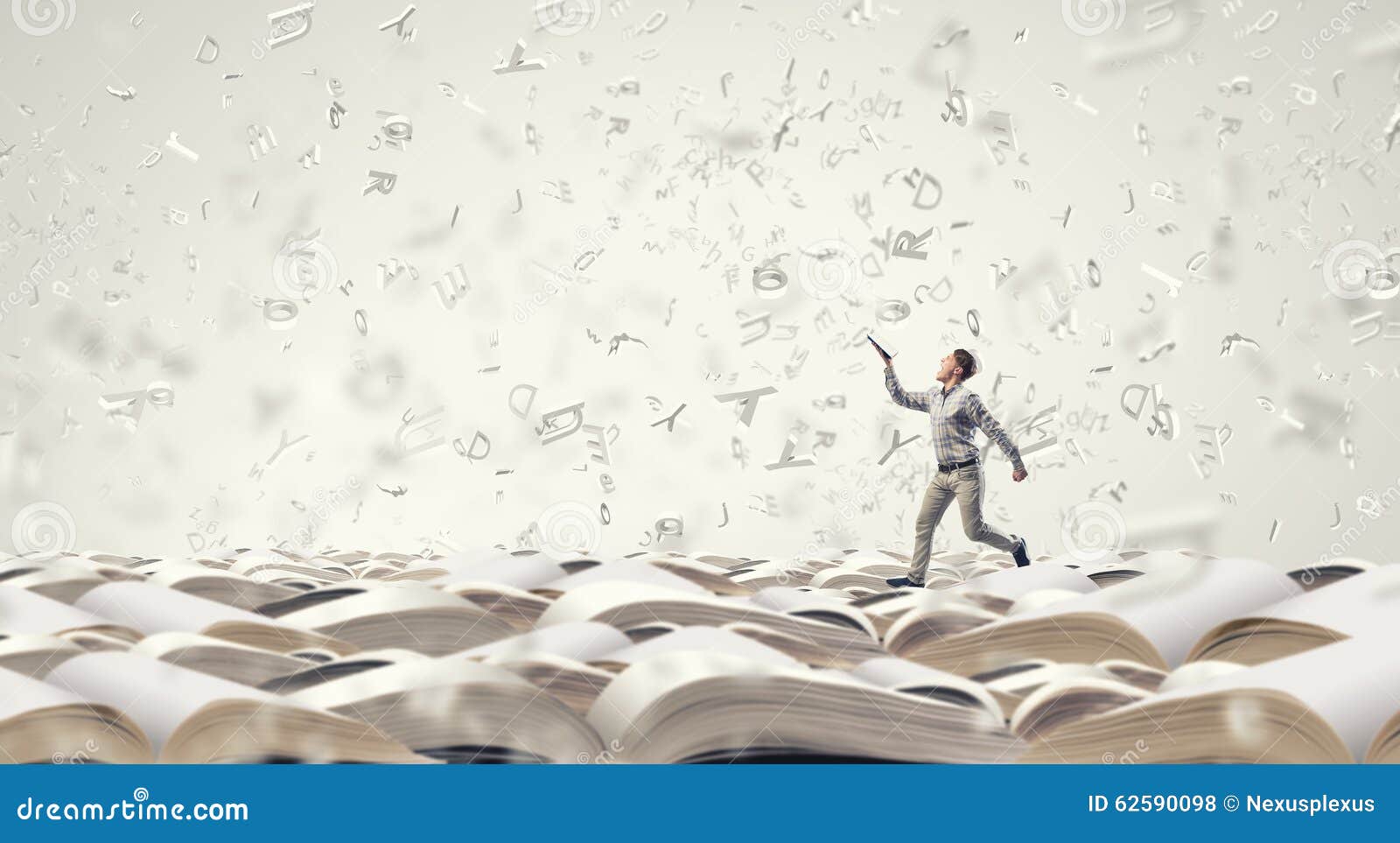 Man with book in hand stock photo. Image of literature - 62590098