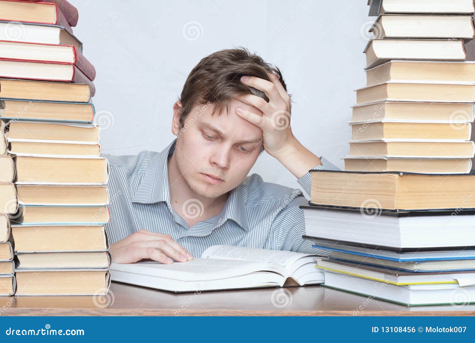 Man between books stock photo. Image of culture, desk - 13108456