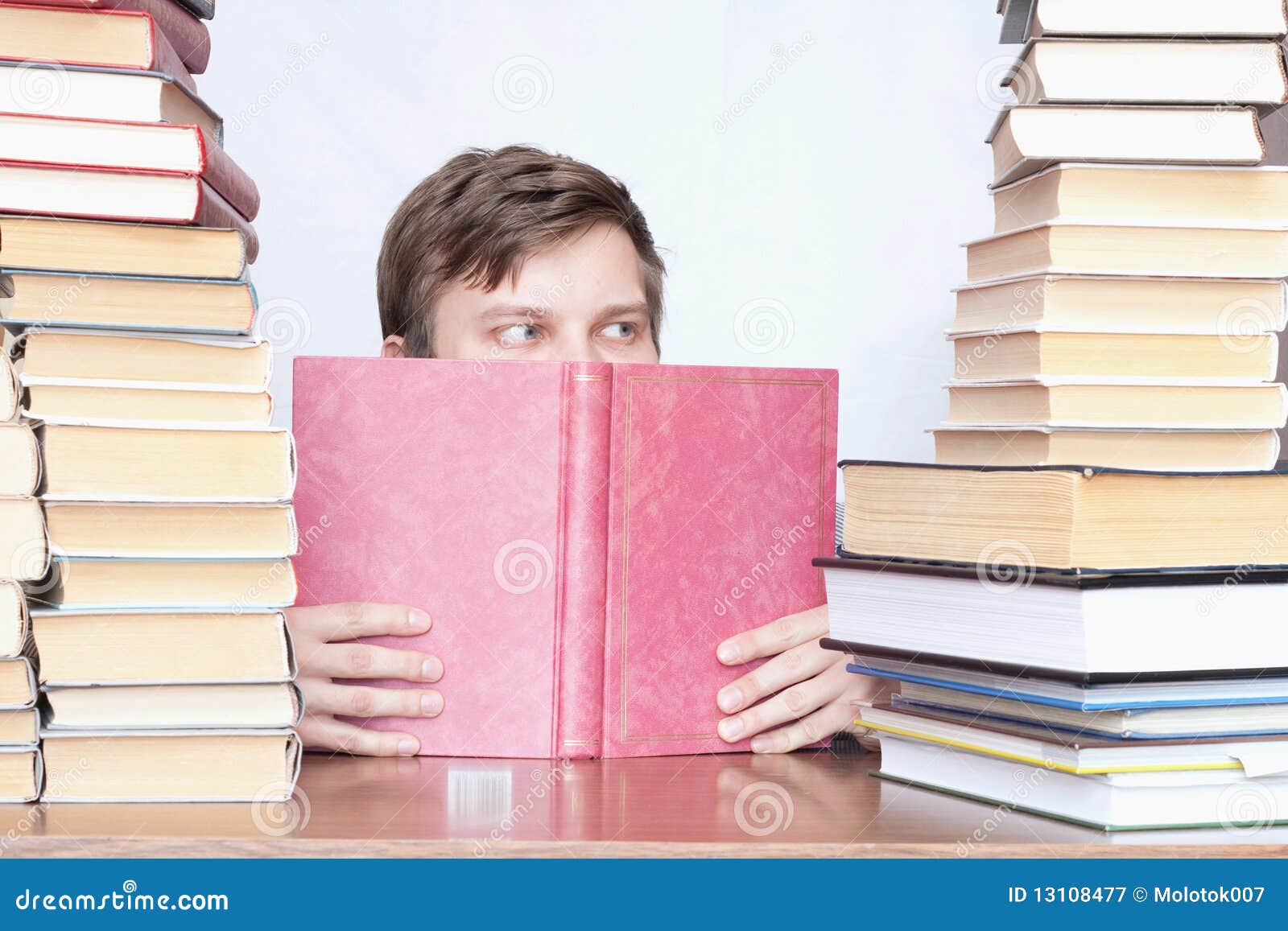Man between books stock image. Image of school, schoolboy - 13108477