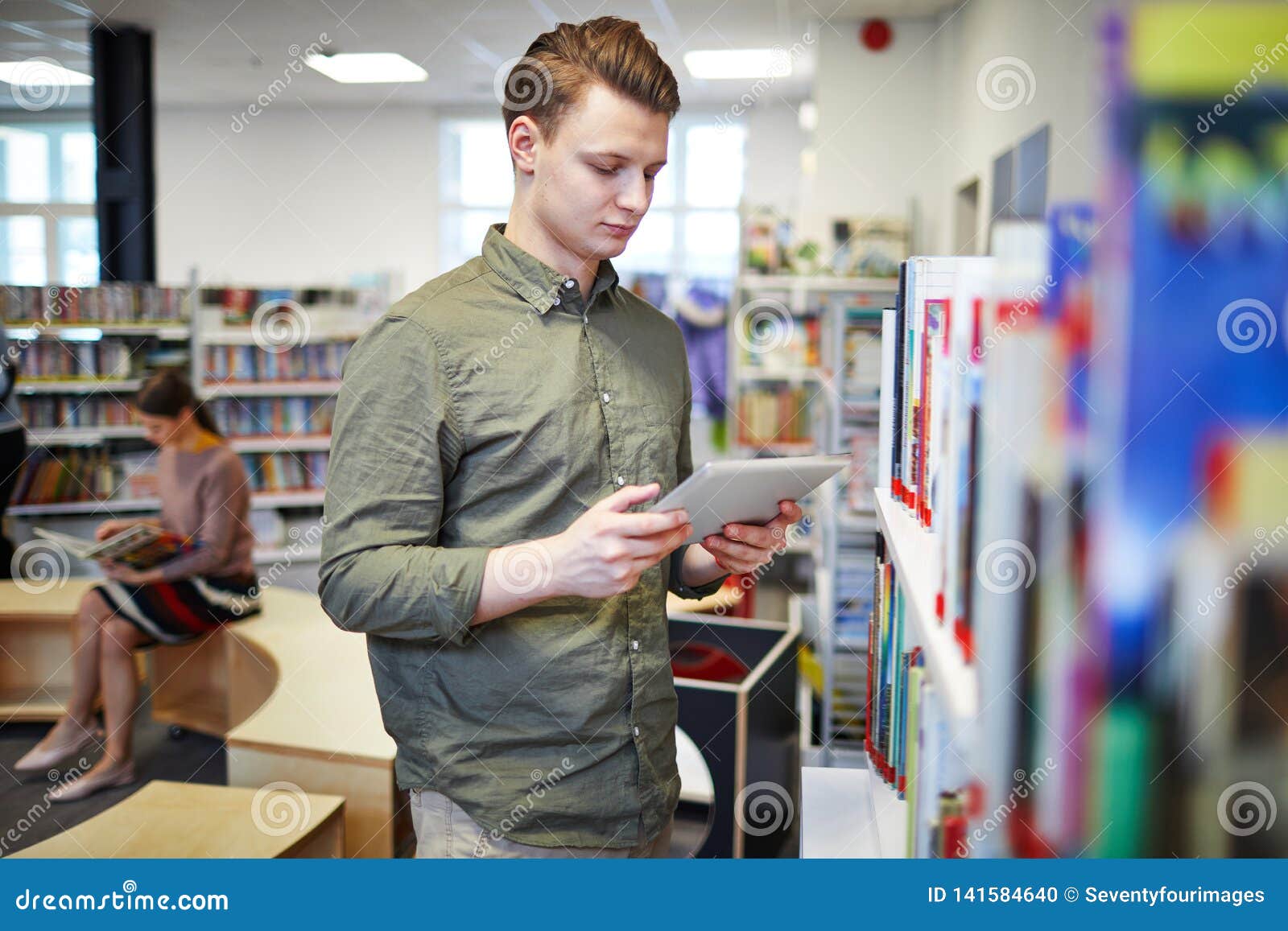 Man in bookshop stock photo. Image of person, communication - 141584640