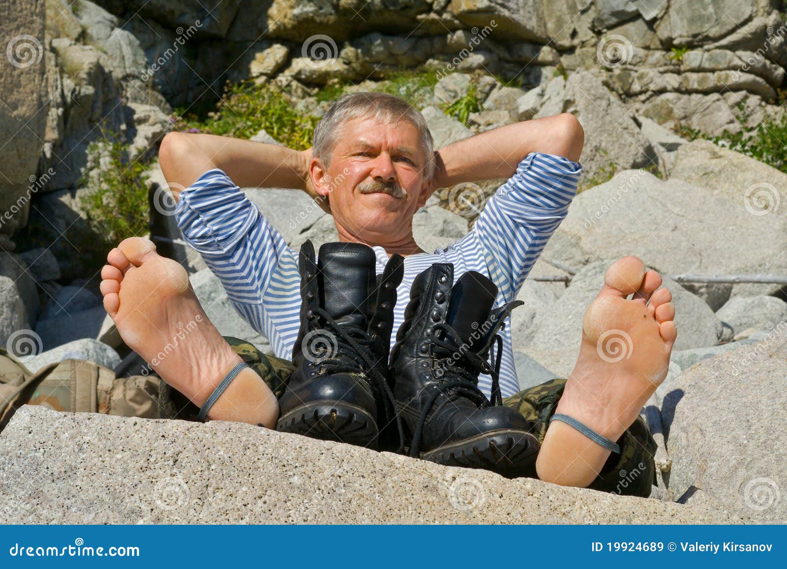 Man and boots 1 stock image. Image of resting, outdoors - 19924689