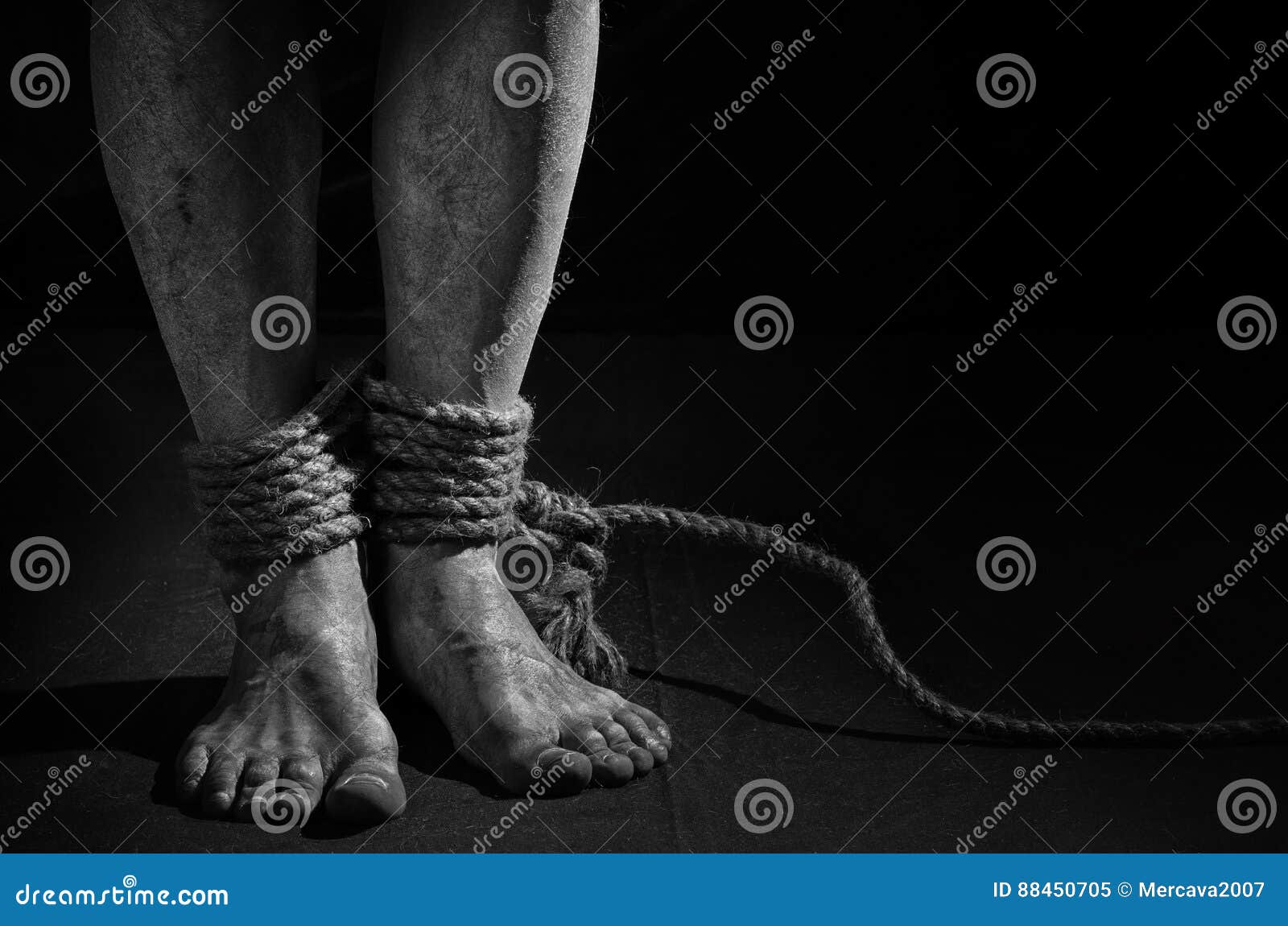 A man with bound legs. stock image. Image of victim, barefoot - 88450705