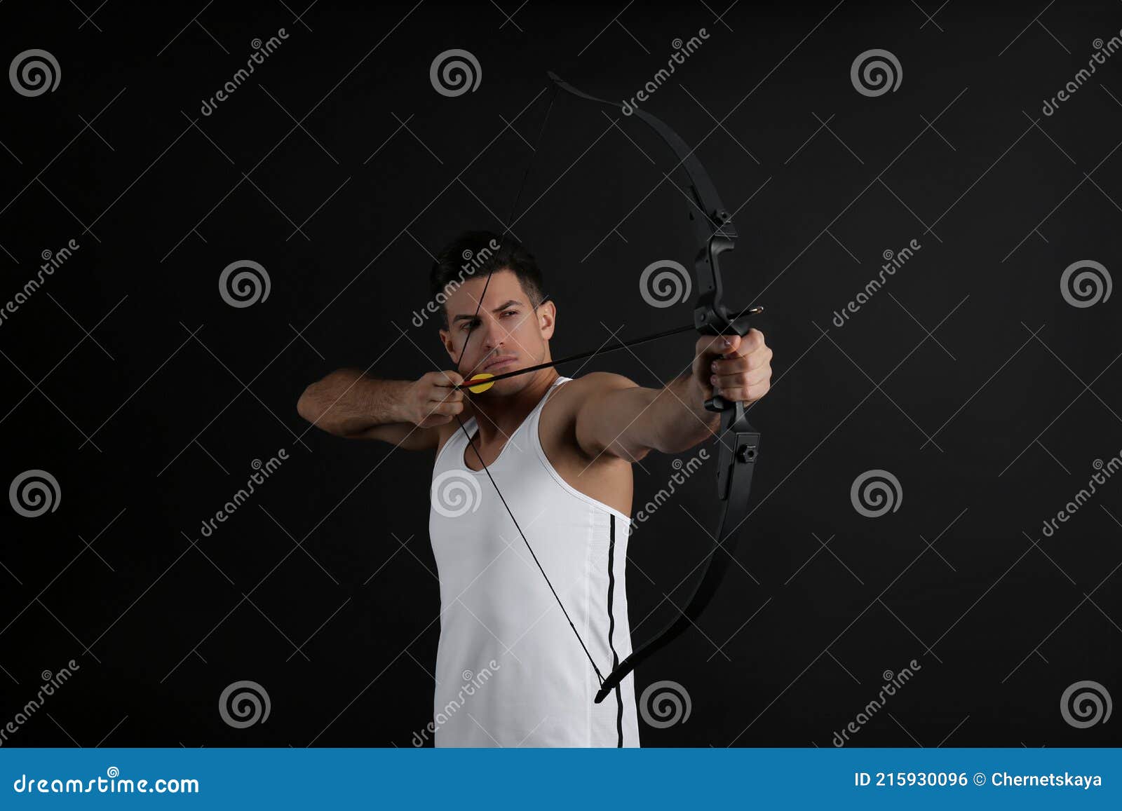 Man with Bow and Arrow Practicing Archery on Black Background Stock ...