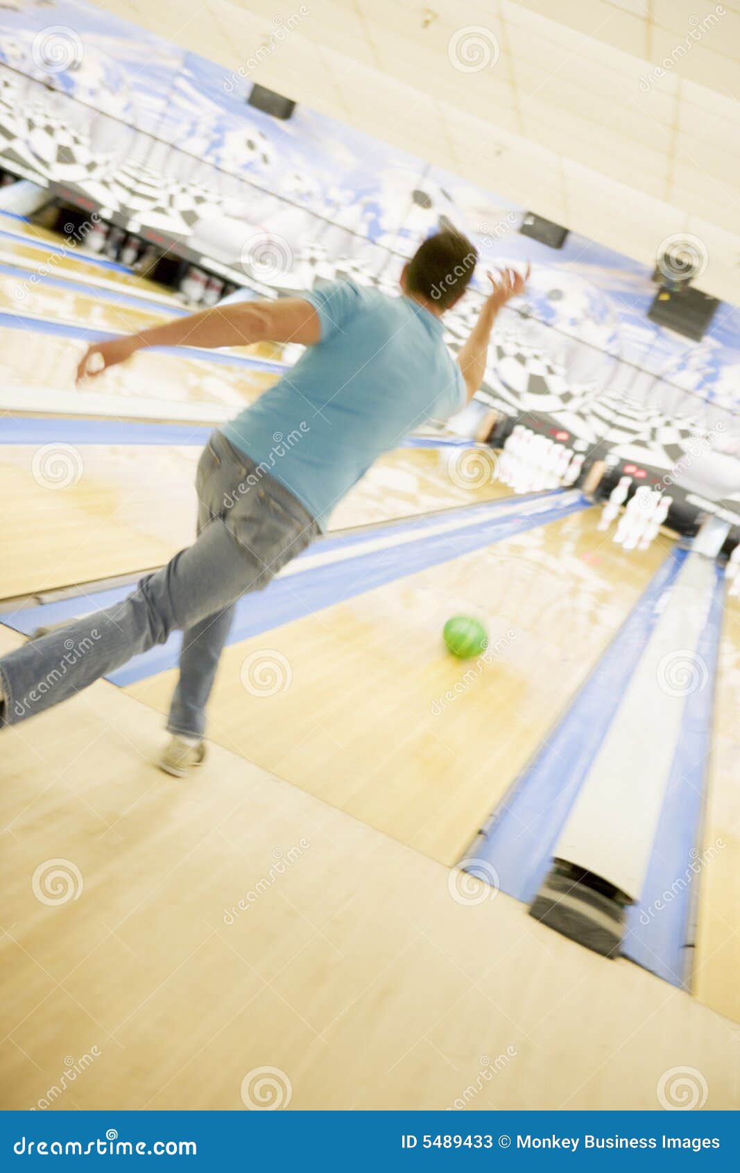 Man bowling, rear view stock image. Image of releasing - 5489433