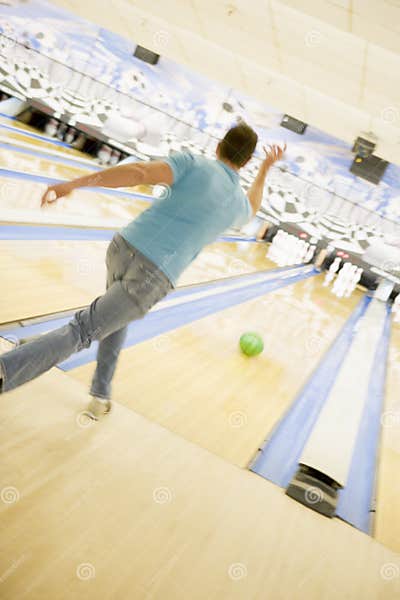 Man bowling, rear view stock image. Image of releasing - 5489433