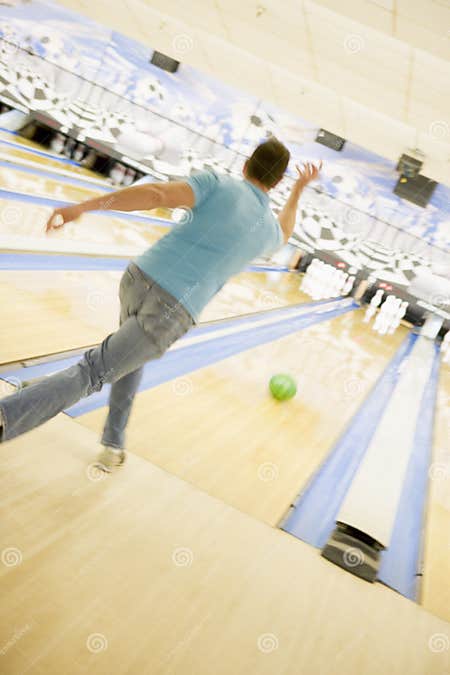 Man bowling, rear view stock image. Image of releasing - 5489433