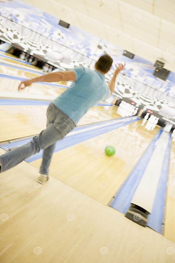 Man bowling, rear view stock image. Image of releasing - 5489433