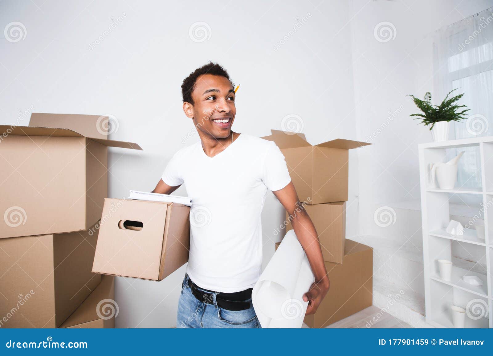 Man with a Box in His Hands is Planning a New Home Interior Stock Image ...