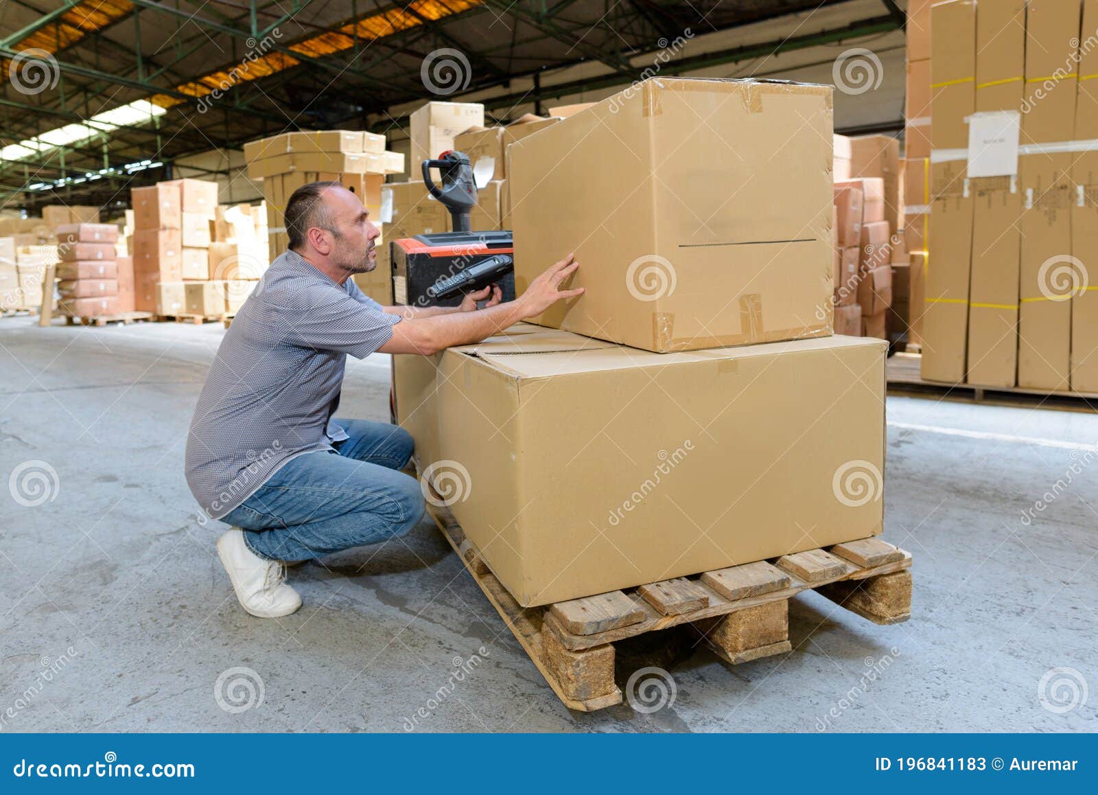 Man with Boxes in Warehouse Stock Image - Image of space, package ...
