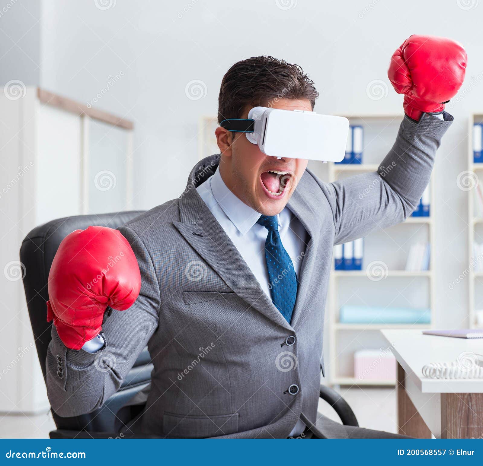 Man Boxing in the Office with Virtual Reality Goggles Stock Image ...