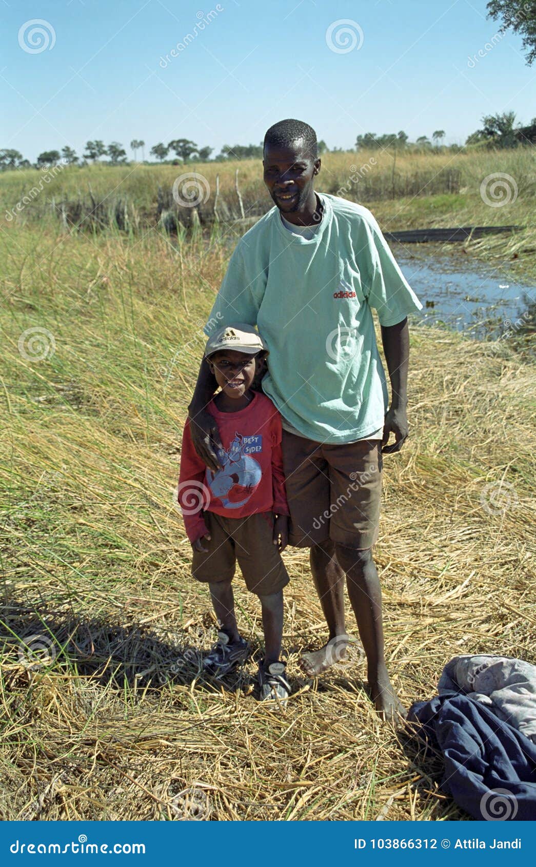 Man and Boy, Okavango Delta, Botswana Editorial Photography - Image of ...