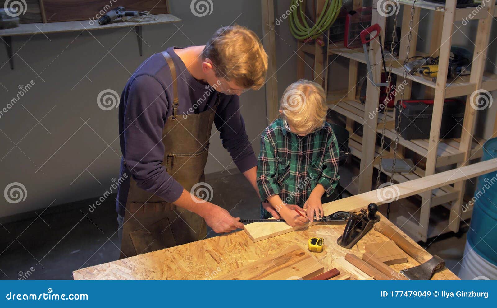 Man and Boy Work with Wood Board in the Workshop Stock Image - Image of ...