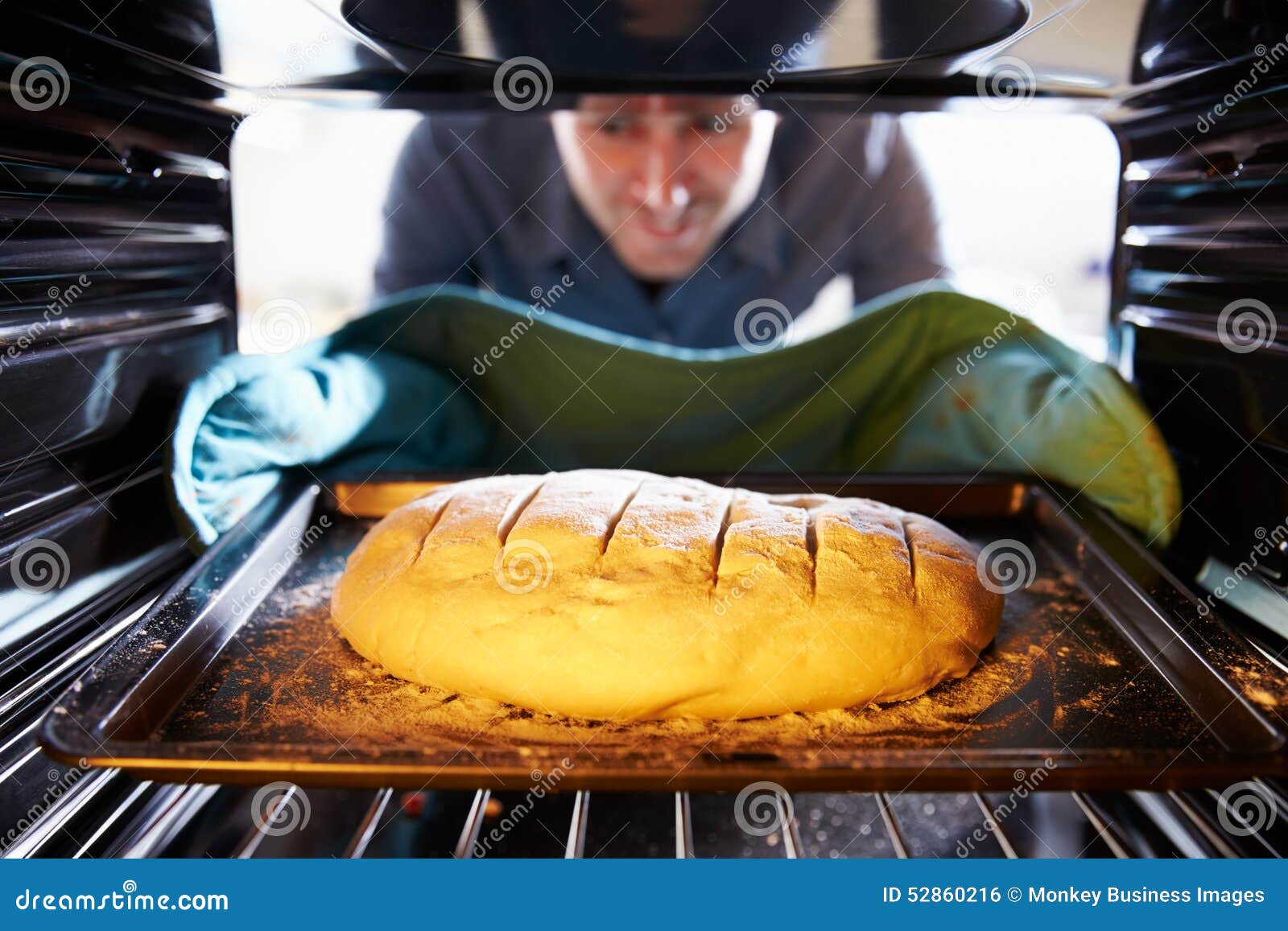 Man Bread into Oven To Bake Stock Photo - Image of inside, kitchen ...