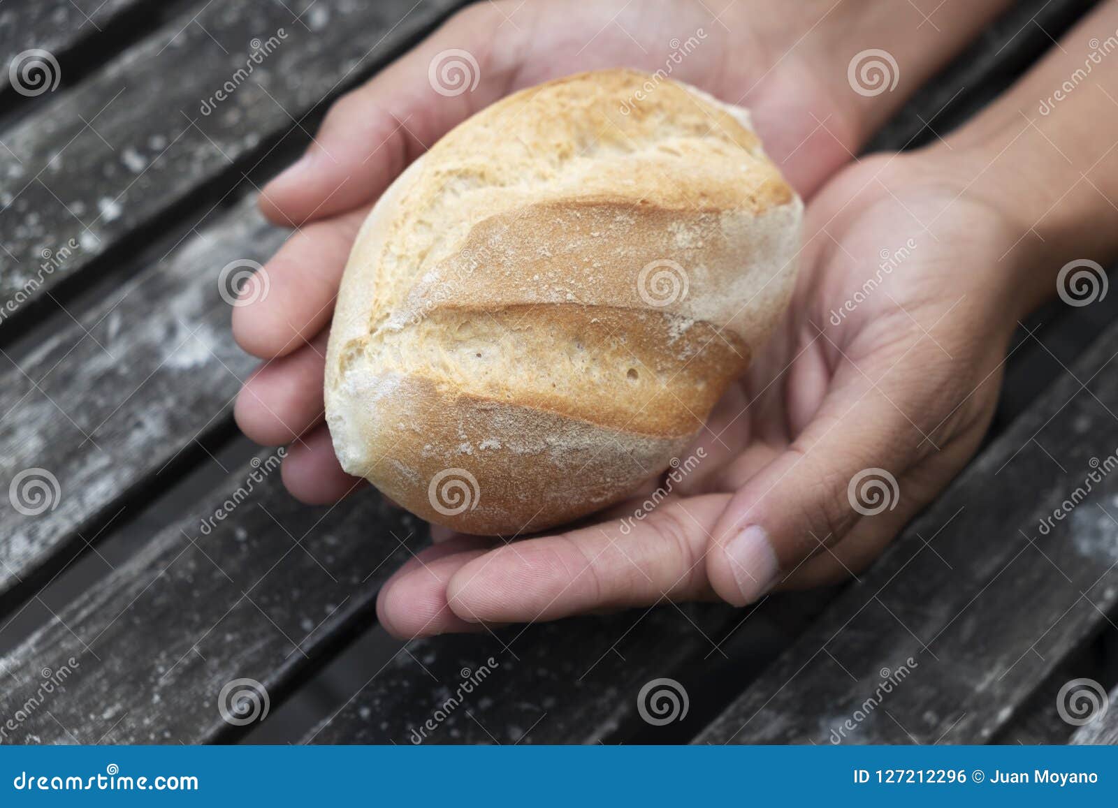 Man with a Bread Roll in His Hands Stock Photo - Image of flour, hands ...