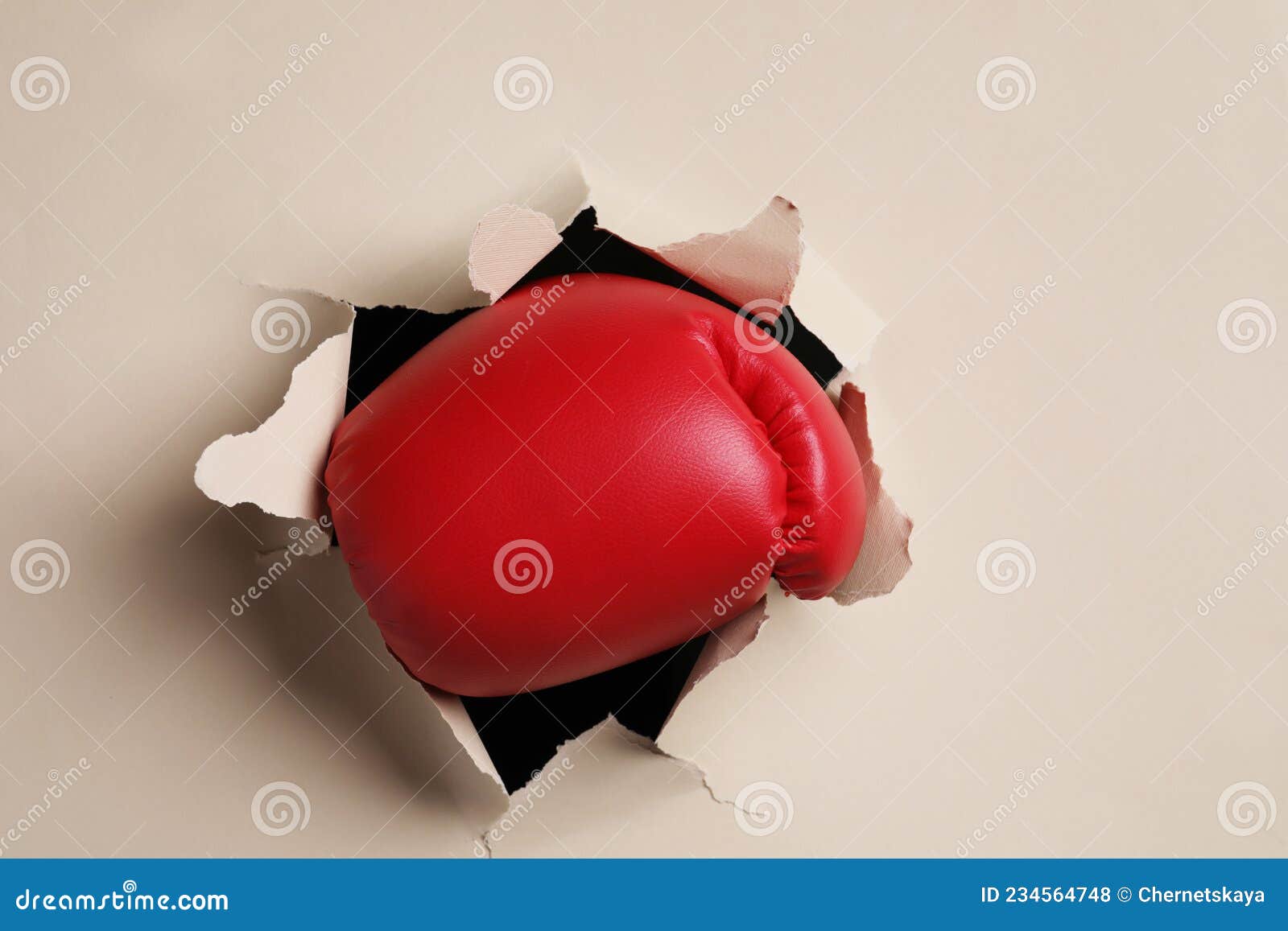 Man Breaking through Beige Paper with Boxing Glove, Closeup Stock Photo ...