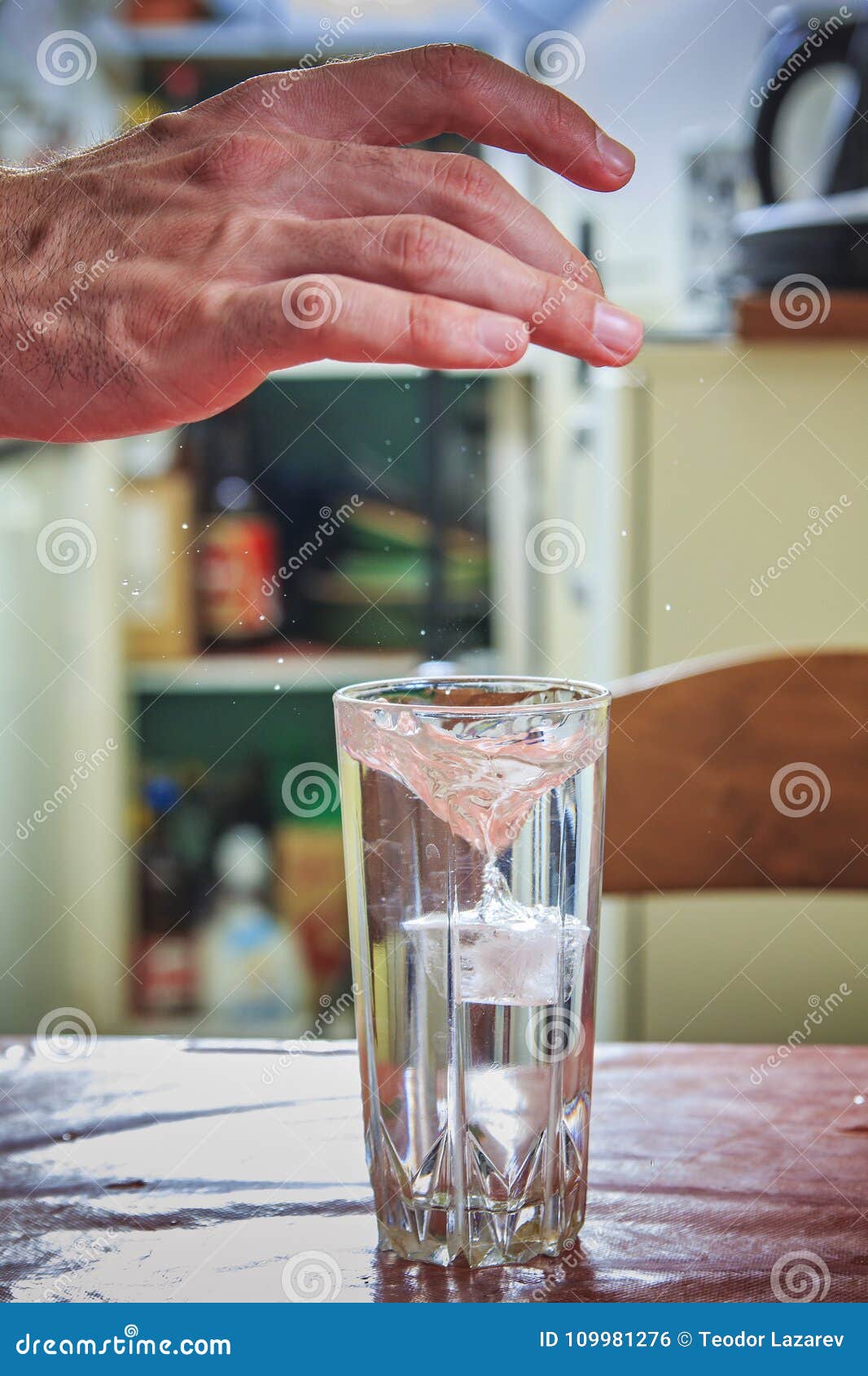 Man Breaking the Ice, Cooling Water in a Glass Stock Photo - Image of ...