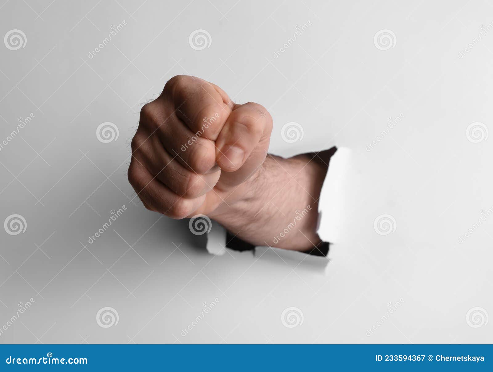Man Breaking through White Paper with Fist, Closeup Stock Image - Image ...