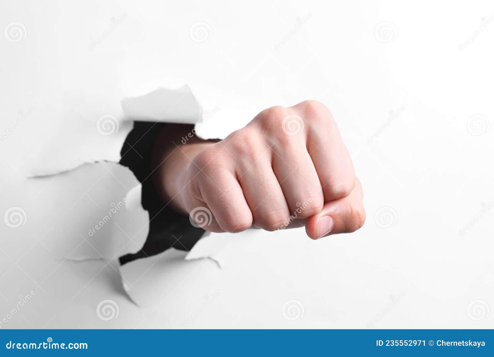 Man Breaking through White Paper with Fist, Closeup Stock Image - Image ...