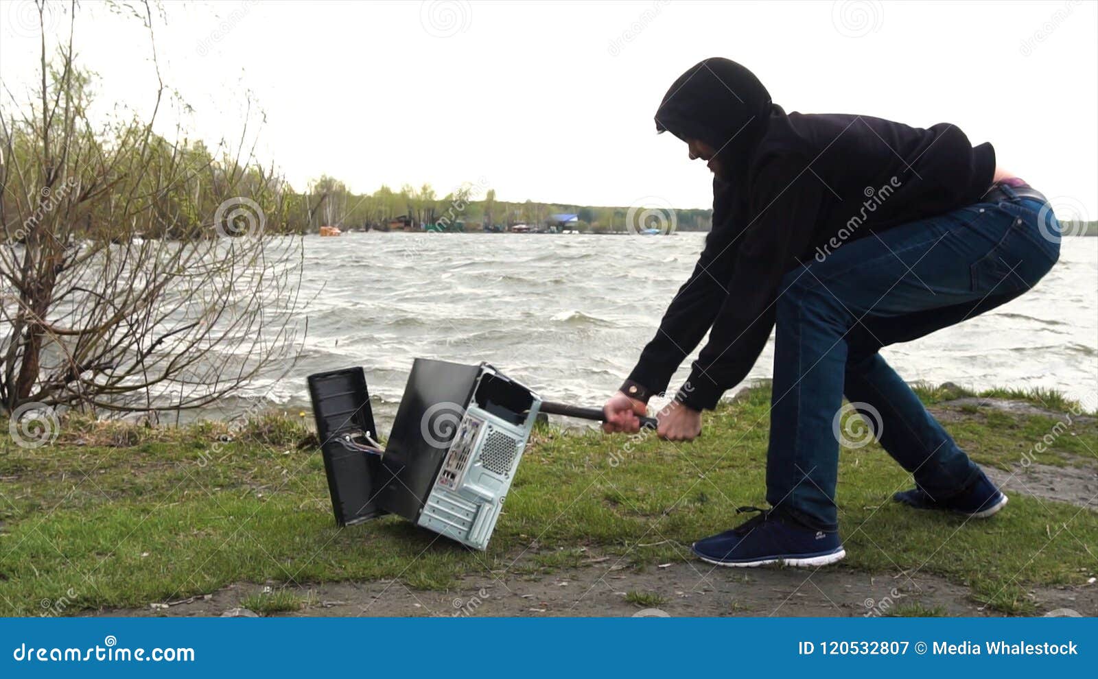 Man Breaks a Hammer System Unit Computer. Man with a Sledge Hammer and ...