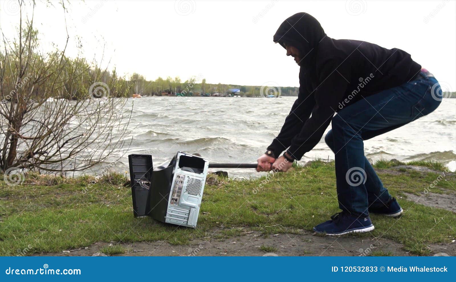 Man Breaks a Hammer System Unit Computer. Man with a Sledge Hammer and ...