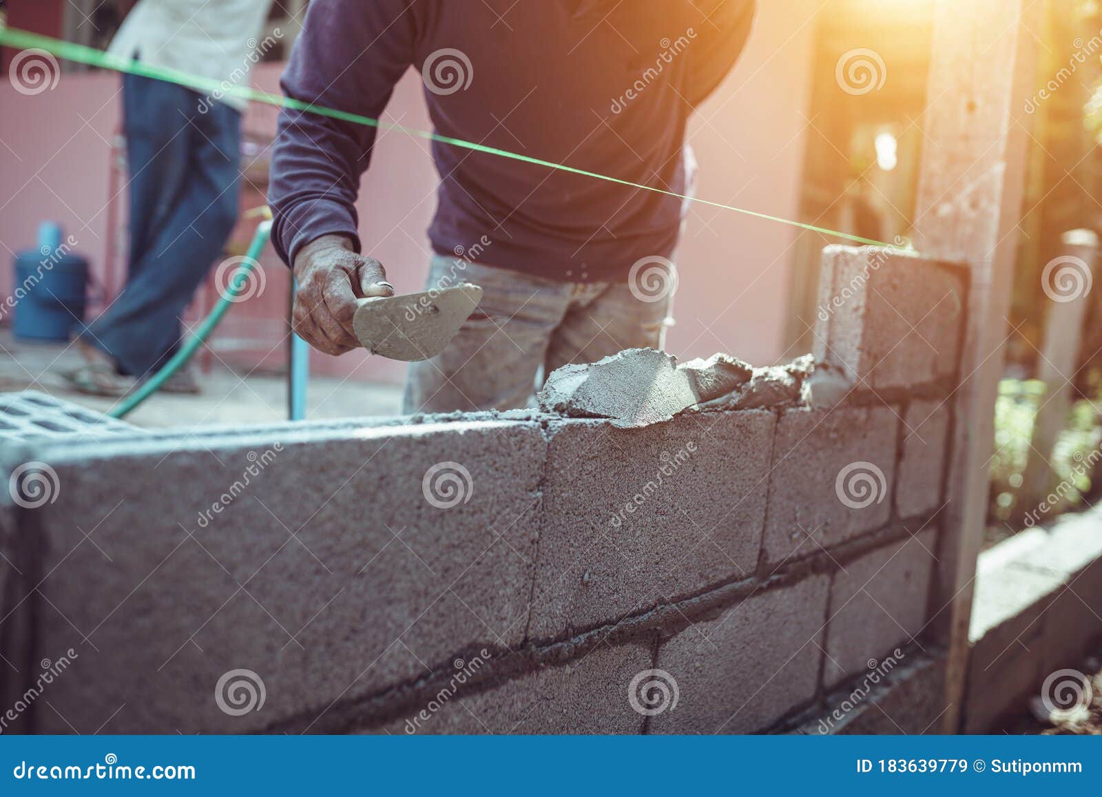 Man Bricklayer Building a Brick Wall or Wall Construction Stock Image ...