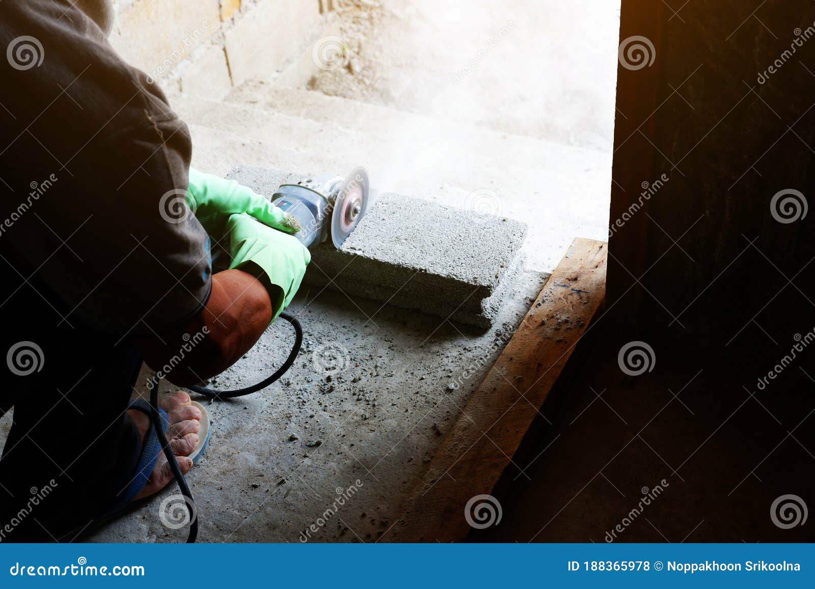 Man Bricklayer is Cutting Cement Brick Block with Small Cutter Machine ...