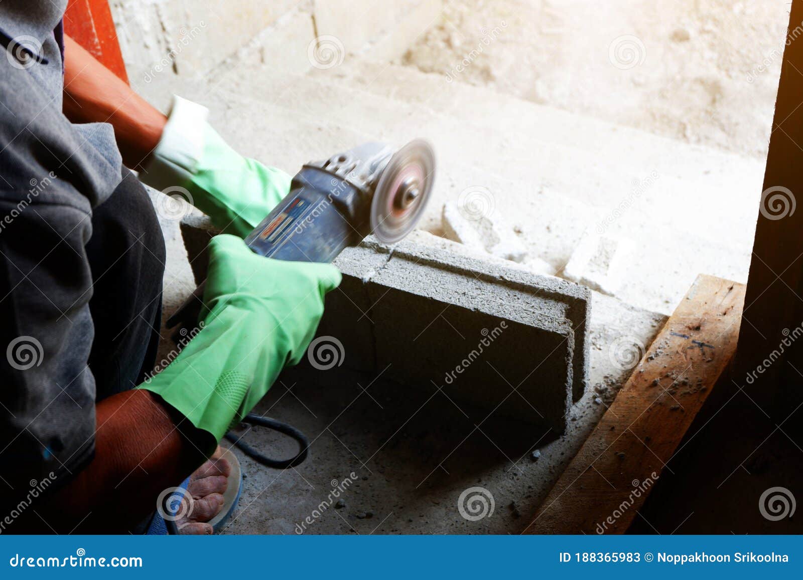 Man Bricklayer is Cutting Cement Brick Block with Small Cutter Machine ...