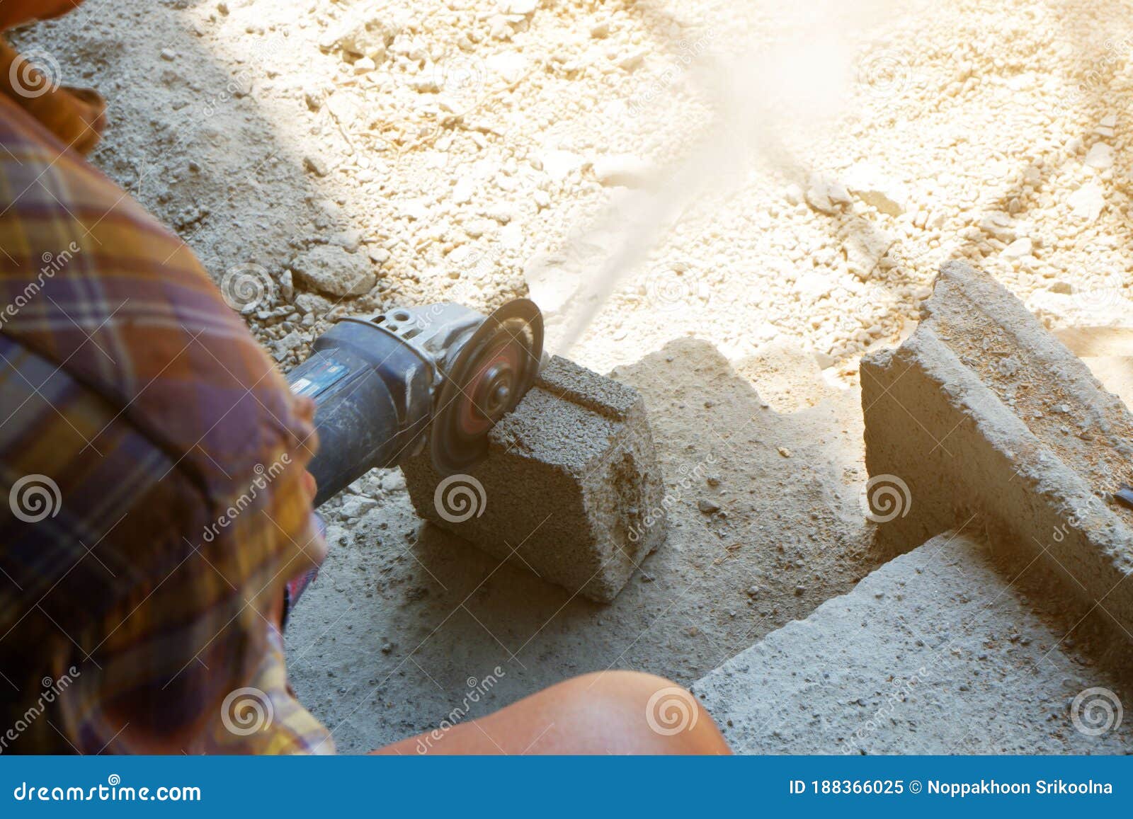 Man Bricklayer is Cutting Cement Brick Block with Small Cutter Machine ...