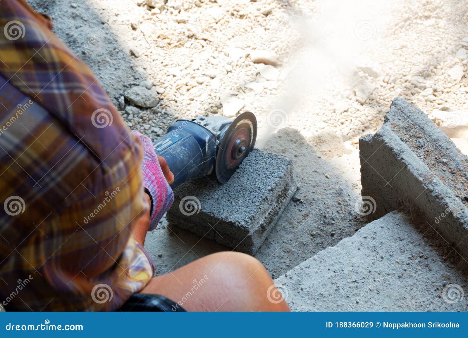 Man Bricklayer is Cutting Cement Brick Block with Small Cutter Machine ...