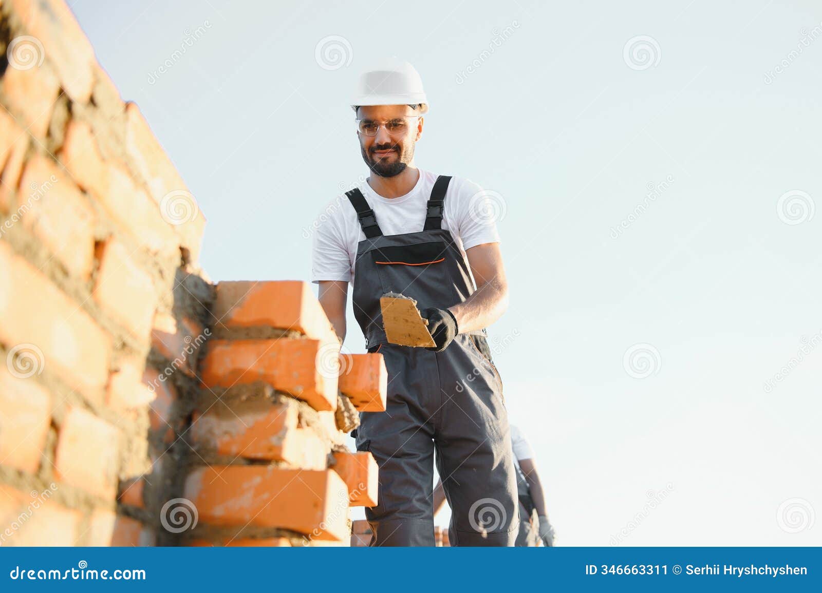 Man Bricklayer Installing Bricks on Construction Site Stock Image ...