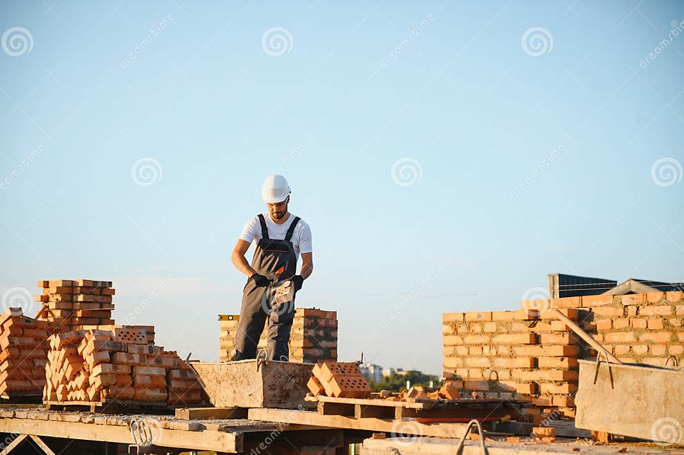 Man Bricklayer Installing Bricks on Construction Site Stock Photo ...