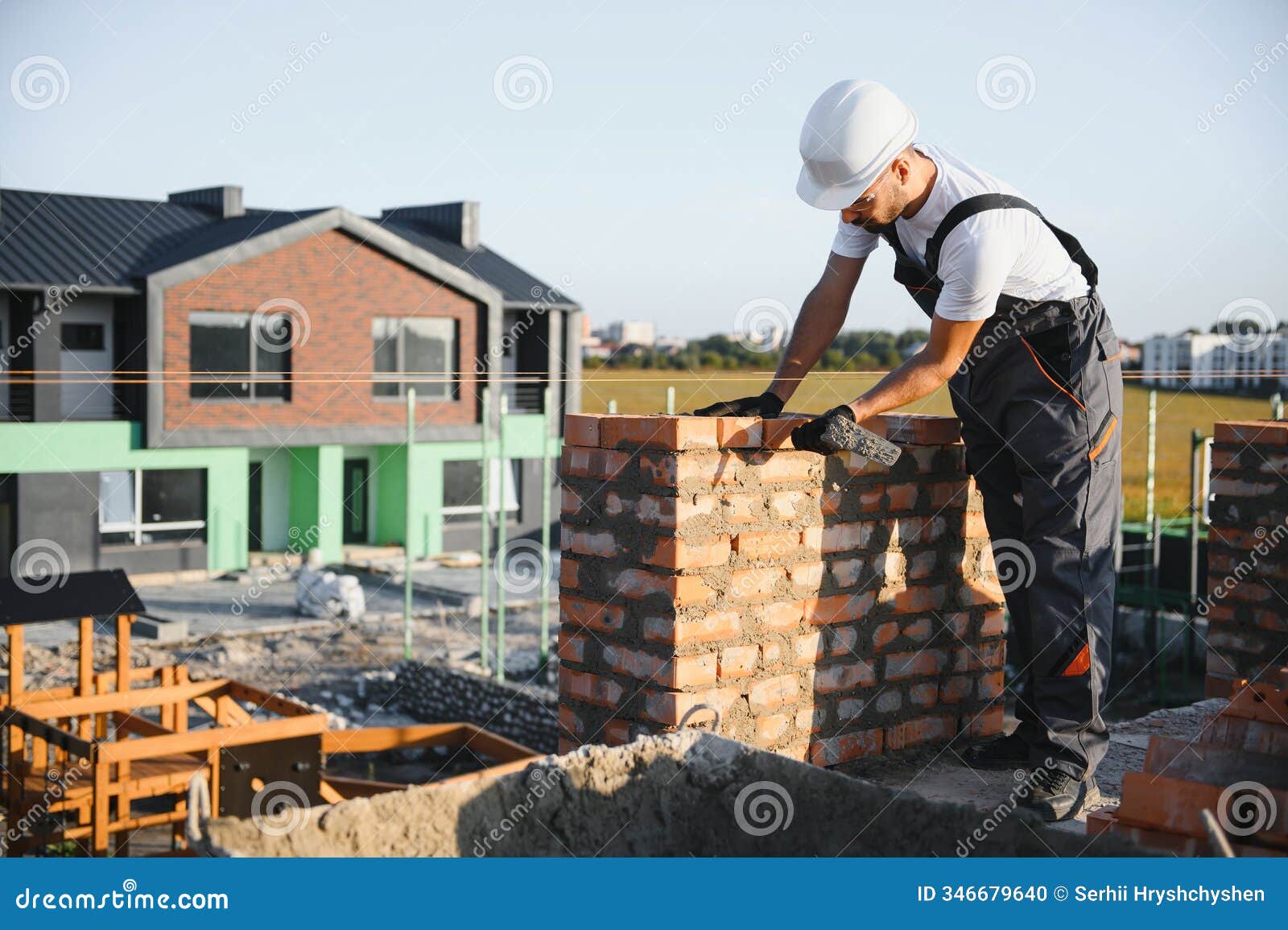 Man Bricklayer Installing Bricks on Construction Site Stock Photo ...