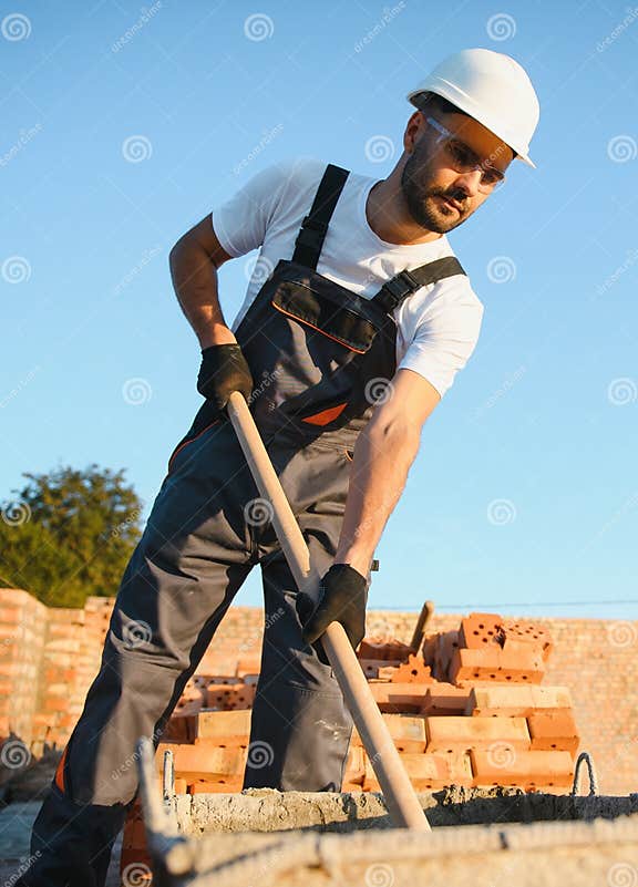 Man Bricklayer Installing Bricks on Construction Site Stock Photo ...