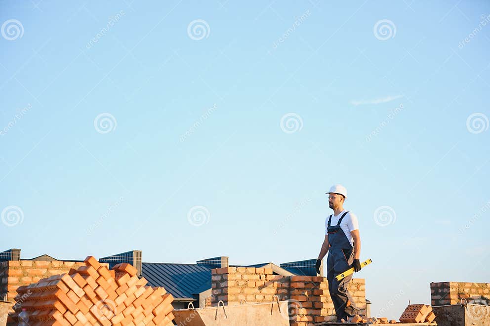 Man Bricklayer Installing Bricks on Construction Site Stock Photo ...