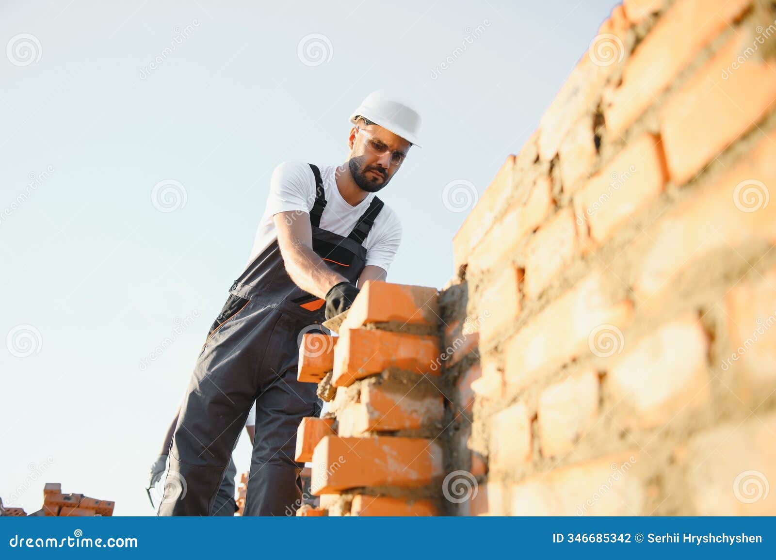 Man Bricklayer Installing Bricks on Construction Site Stock Photo ...